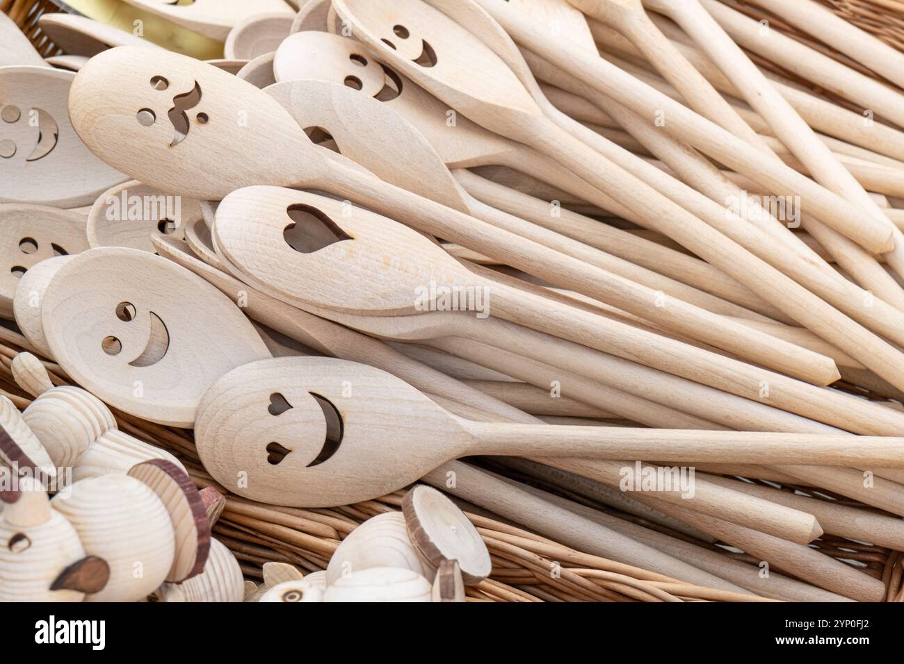 heap of wooden cooking paddles with cutouts shaped like hearts and ...
