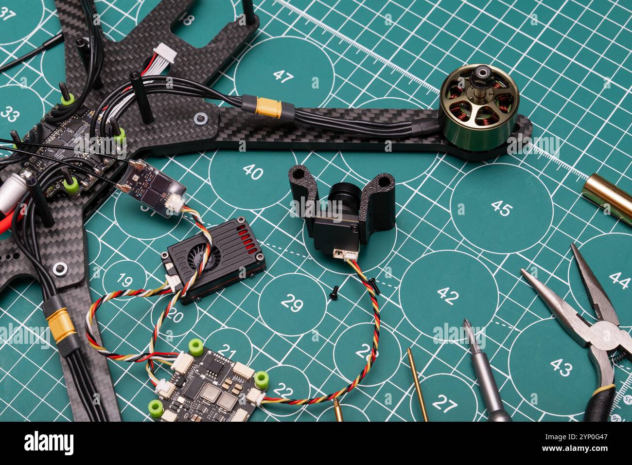 disassembled sport FPV drone body with an electric motor lies on a work ...