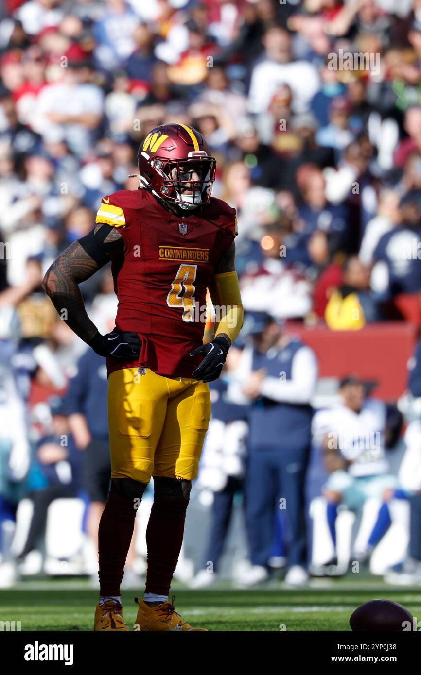 Washington Commanders linebacker Frankie Luvu (4) lines up for the snap ...