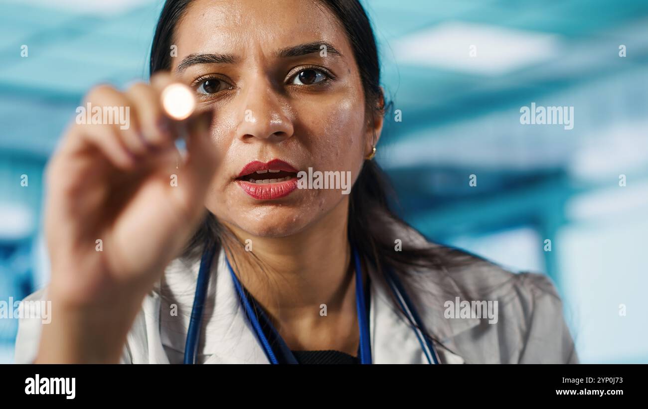 Eye care check up examination in a medical cabinet with an indian medic ...