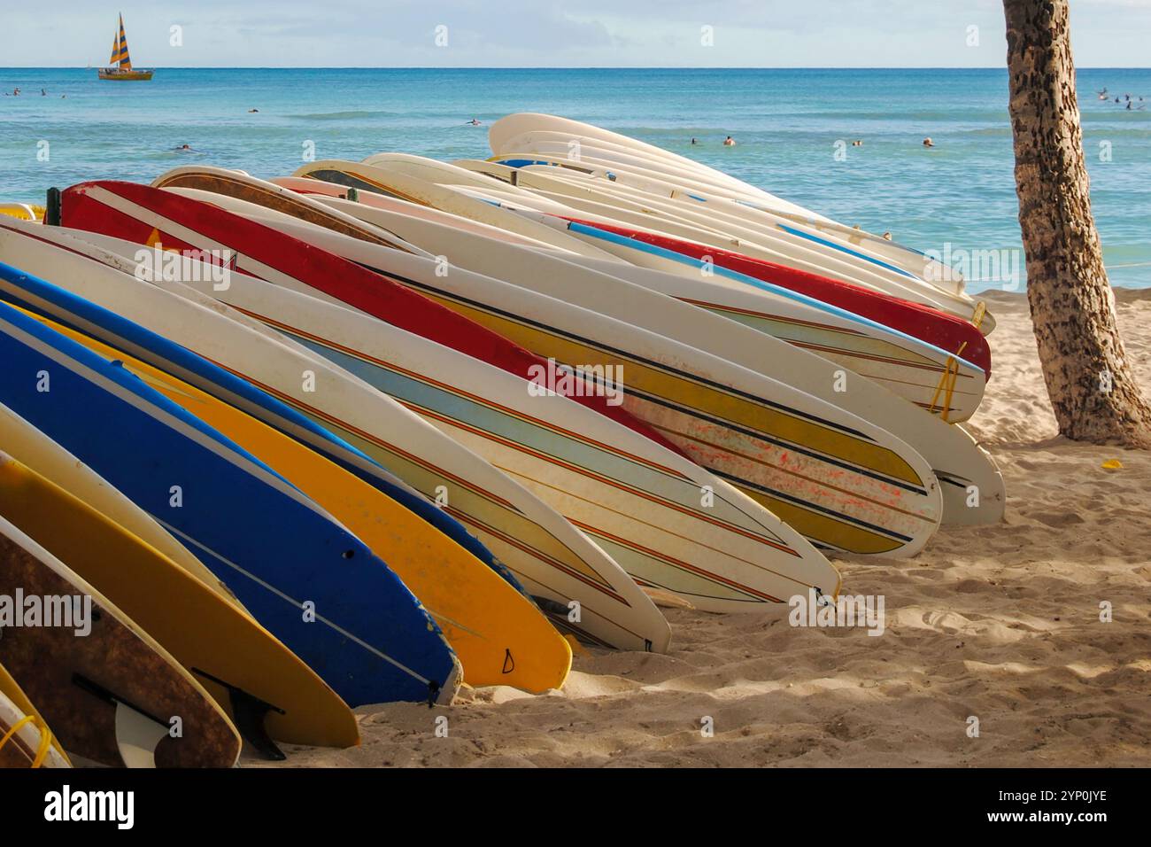 Several surfboards displayed on a rack at a beach in Hawaii Stock Photo ...