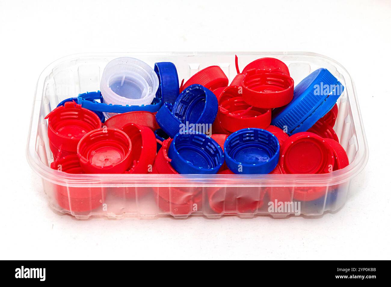 Colorful plastic top caps pile from bottles inside box Stock Photo - Alamy