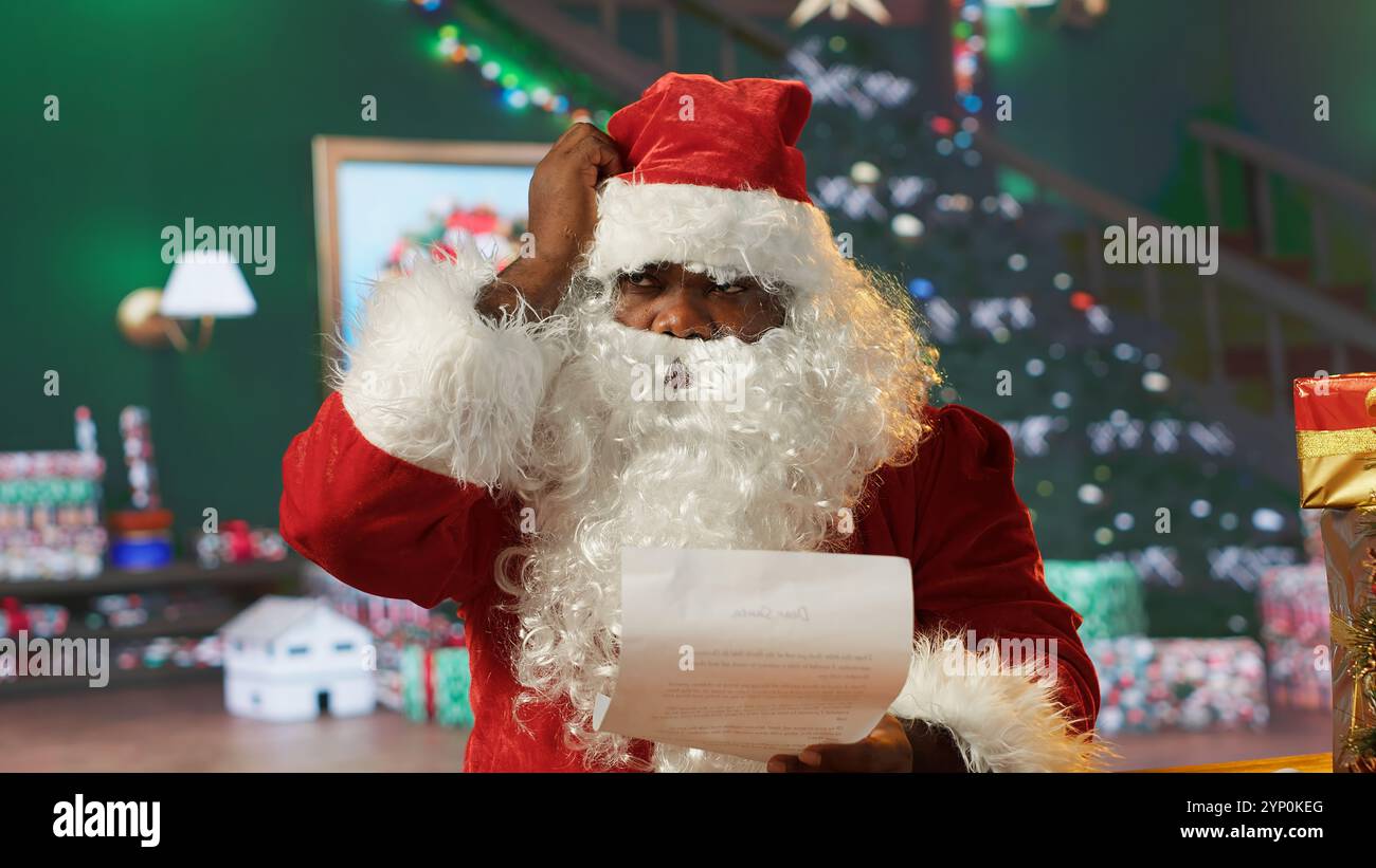 Black Santa opening envelopes with correspondence from kids, fulfilling ...