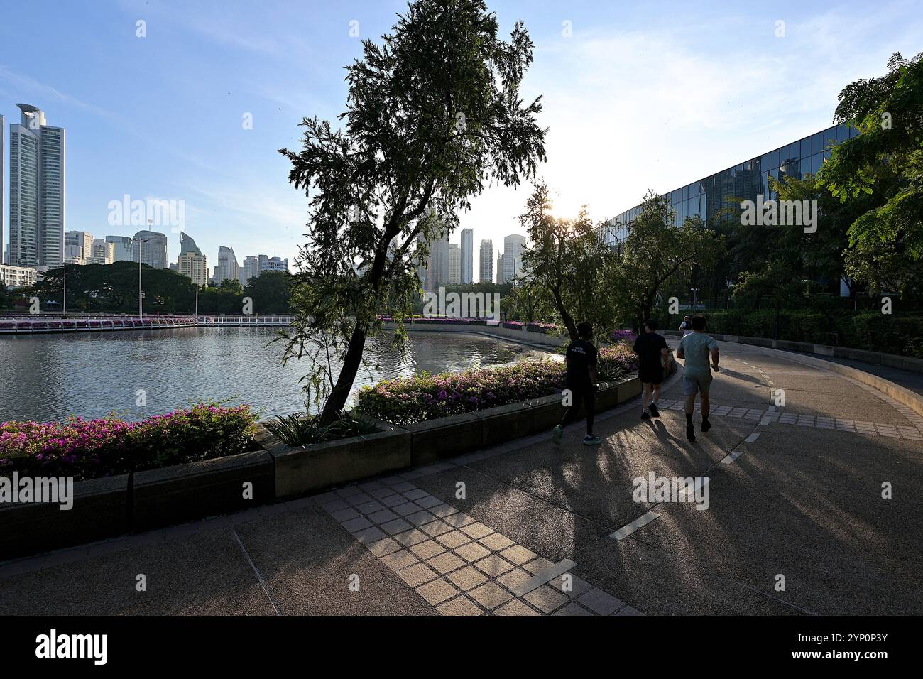 People jogging on the popular running track along Lake Ratchada in ...