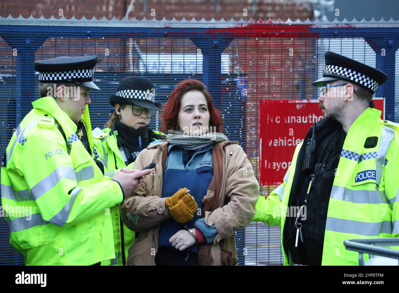 An activist is arrested and led away in handcuffs after being released ...