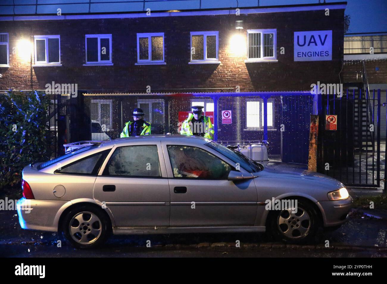 Before the first light police officers stand by one of the blocking ...