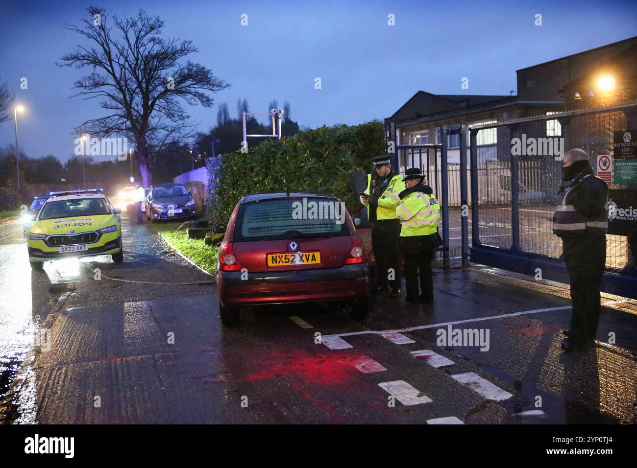 Before the first light police officers stand by one of the blocking ...