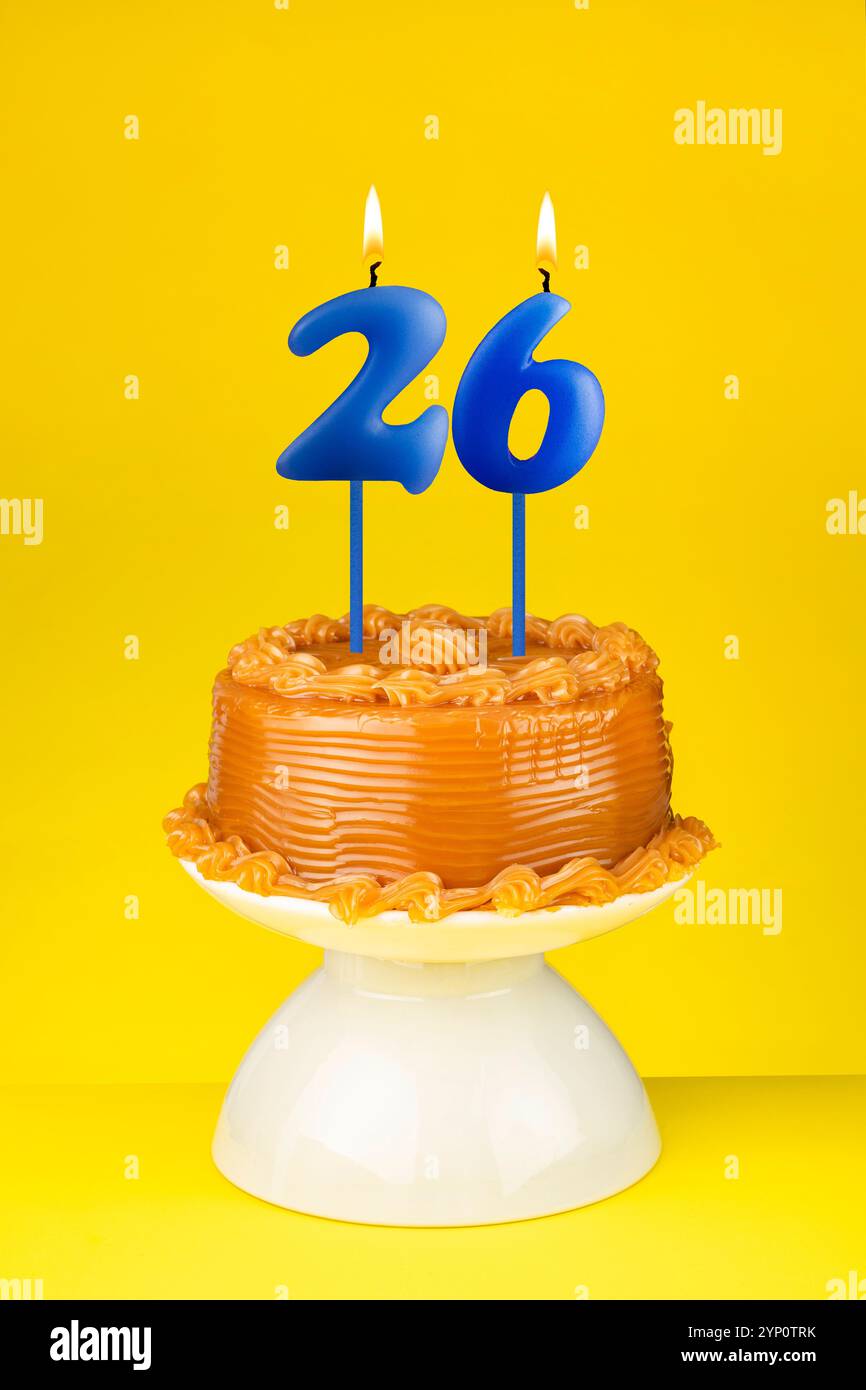Number 26 Candle - Happy Birthday Cake on a yellow background Stock ...