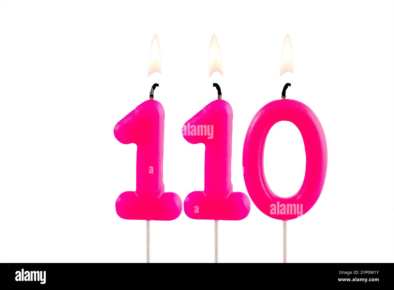 Pink number 110 birthday candle lit on white background Stock Photo - Alamy