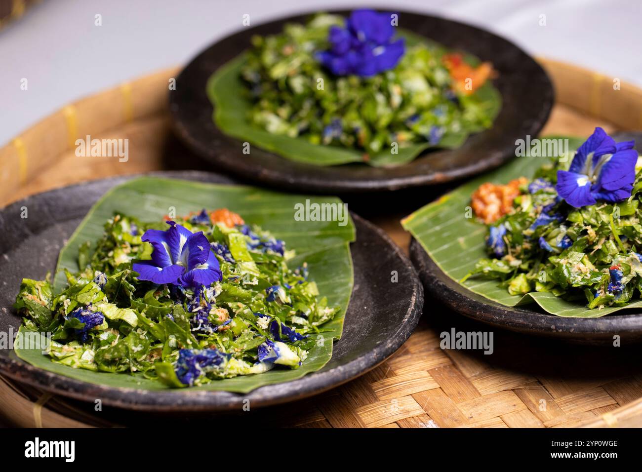Fresh garden salad featuring edible flower “bunga Telang” (Clitoria ...