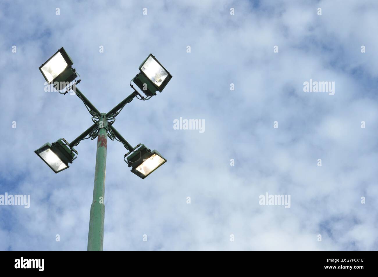 park light poles with white clouds and blue sky backgrounds Stock Photo ...