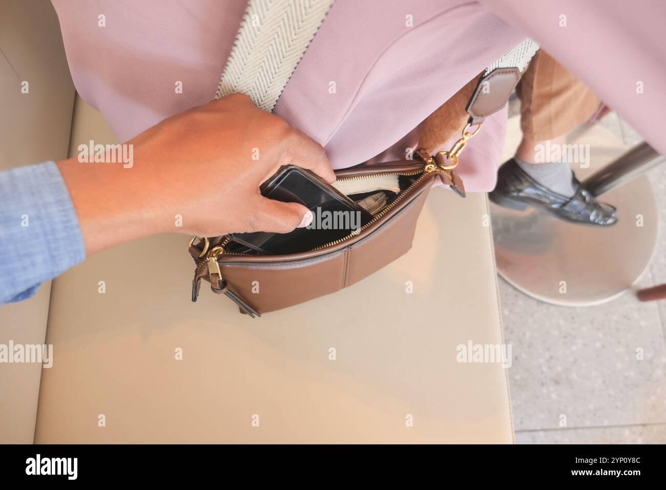 Thief stealing phone from bag hi-res stock photography and images - Alamy