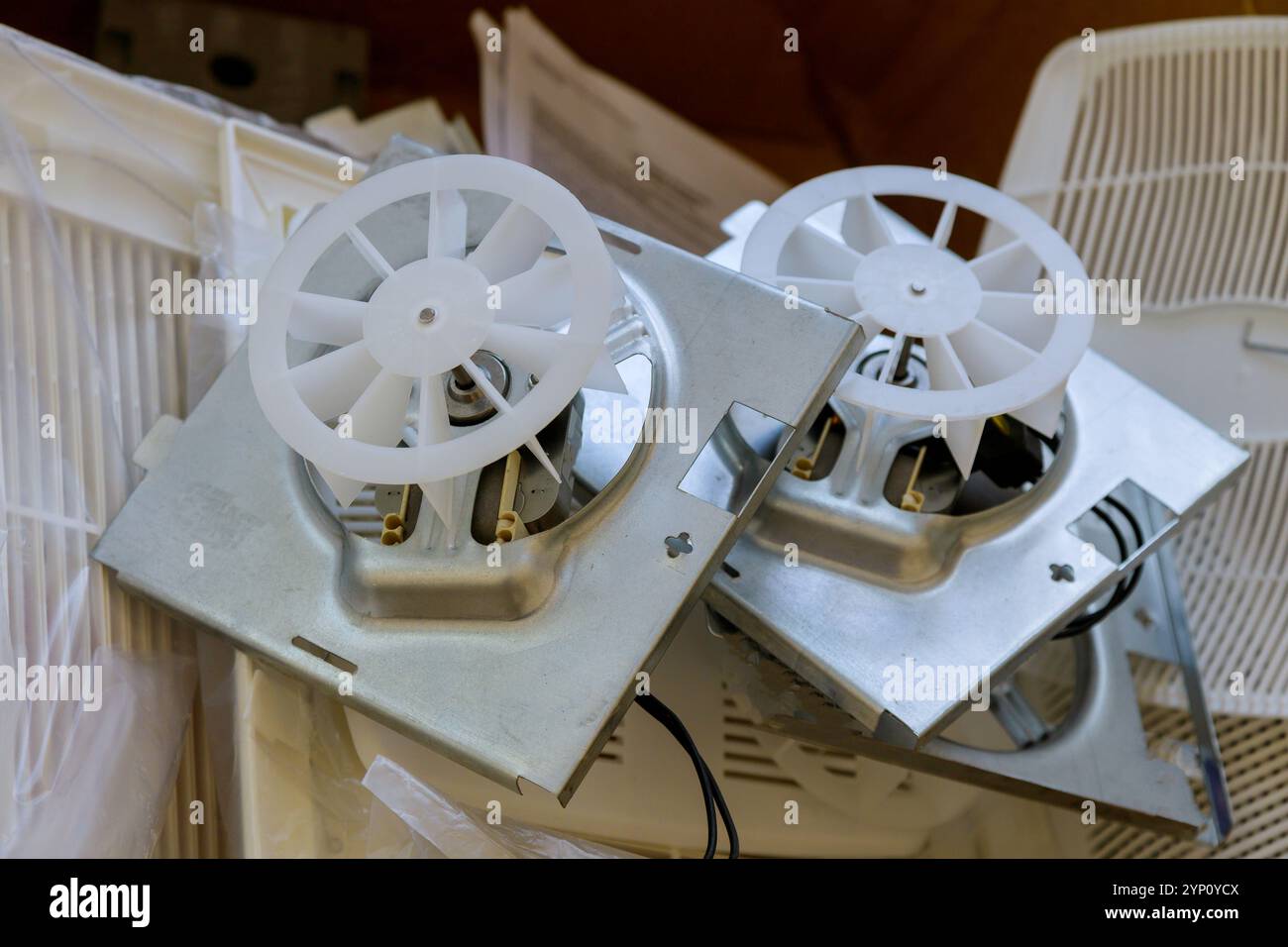 Ventilation fans are disassembled workbench in various components tools ...