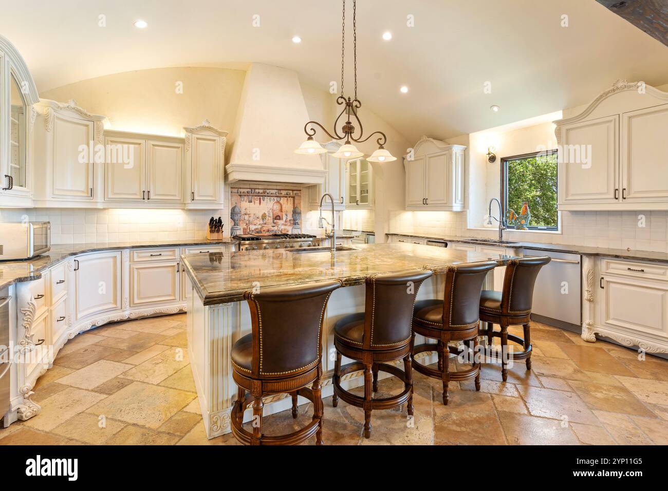 Elegant modern kitchen design with spacious island and natural light ...