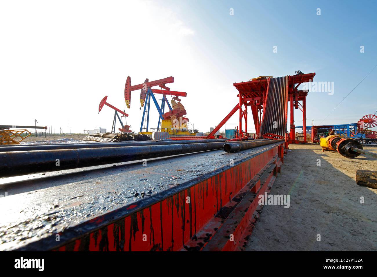 Oil pipe and oil drilling rig equipment Stock Photo - Alamy