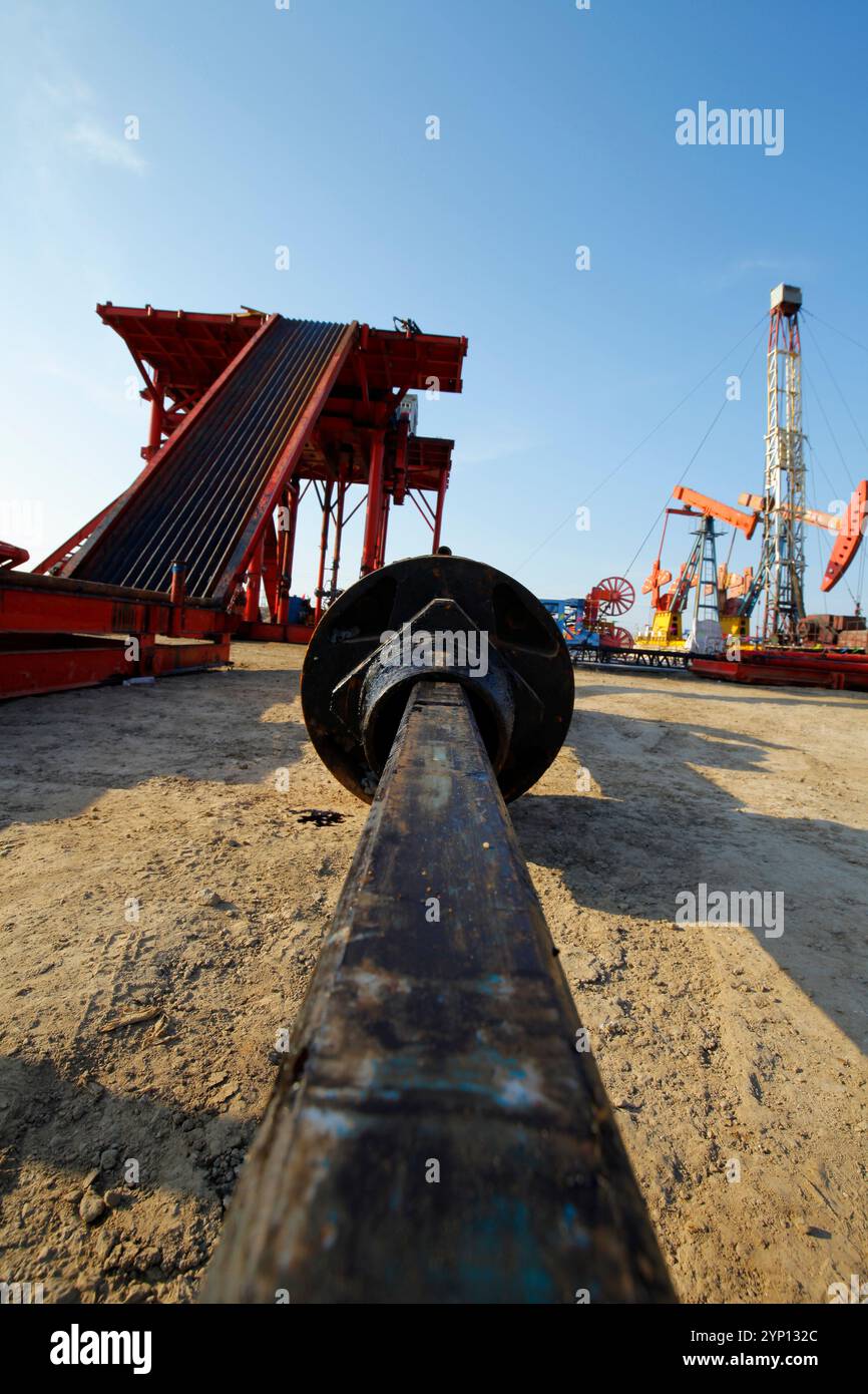Oil pipe and oil drilling rig equipment Stock Photo - Alamy