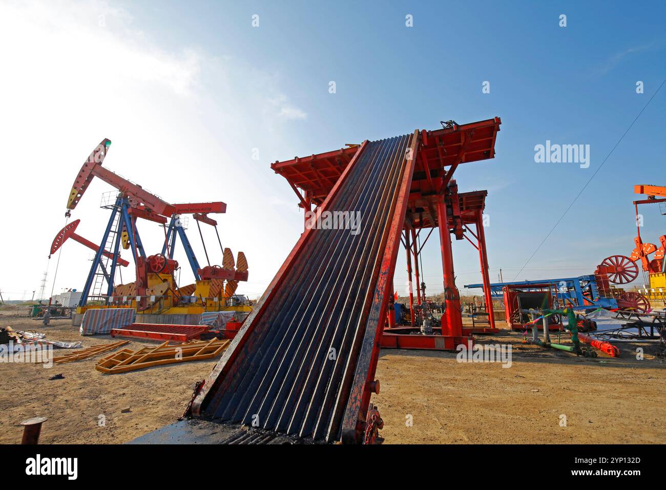 Oil pipe and oil drilling rig equipment Stock Photo - Alamy