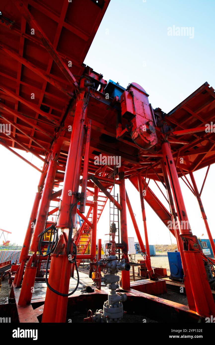 Oil pipe and oil drilling rig equipment Stock Photo - Alamy