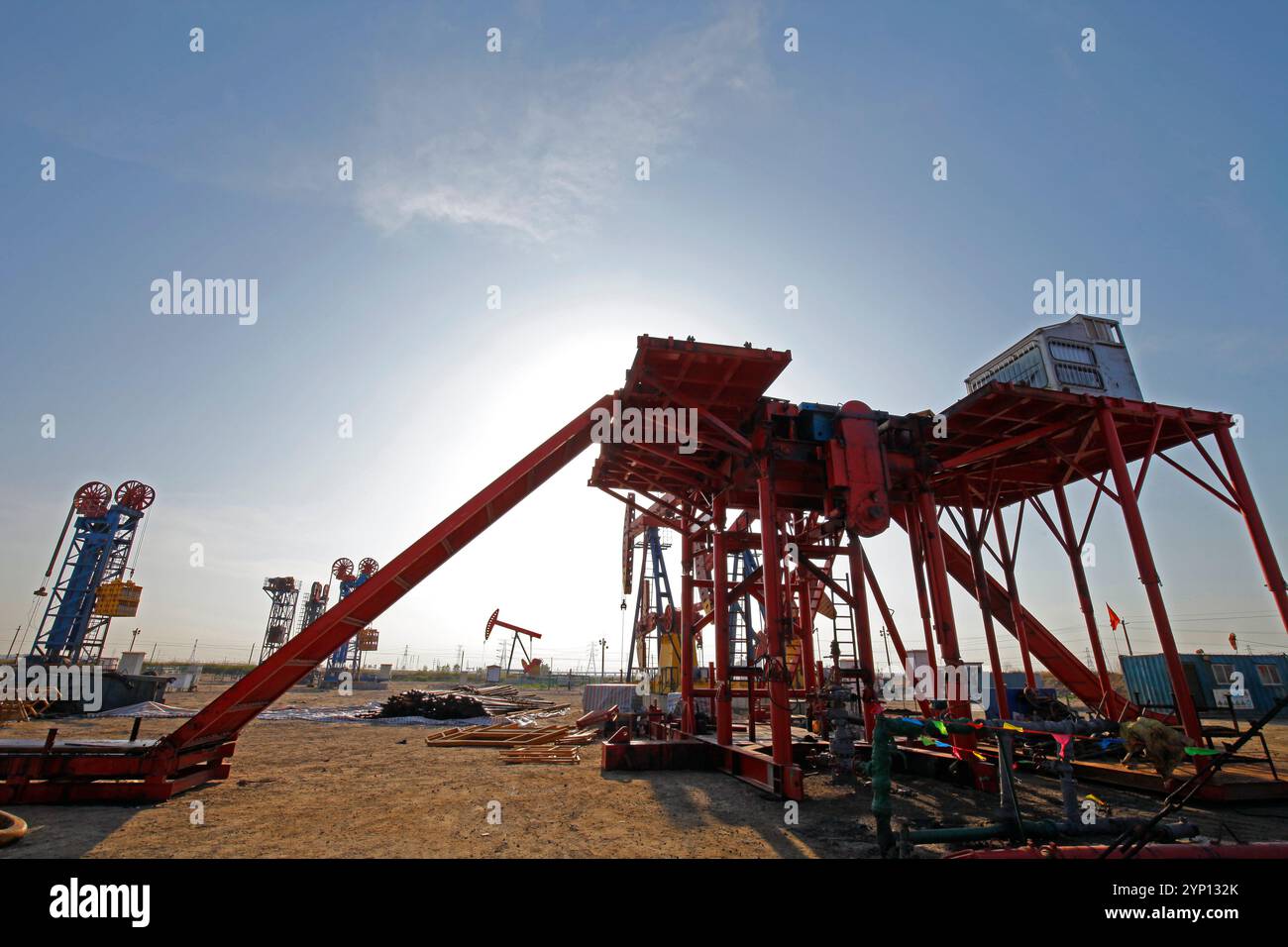 Oil pipe and oil drilling rig equipment Stock Photo - Alamy