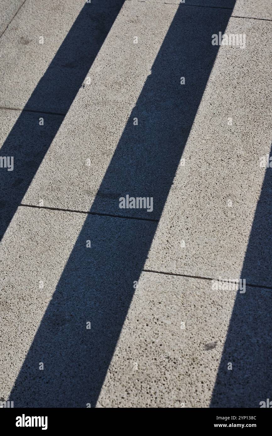 Concrete steps of a staircase made of gray blocks close up. Diagonal ...