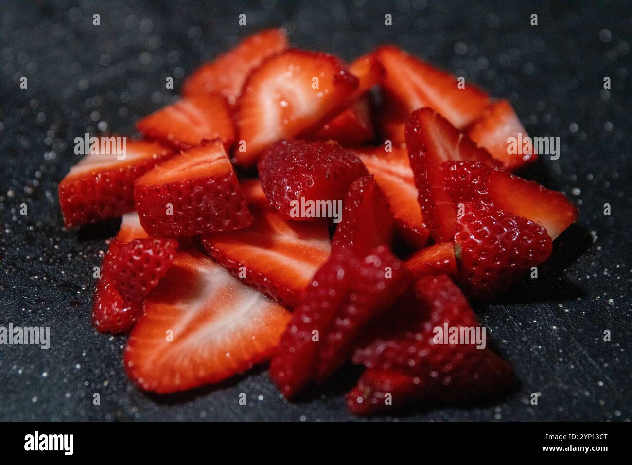 Sliced strawberries prepared as toppings Stock Photo - Alamy