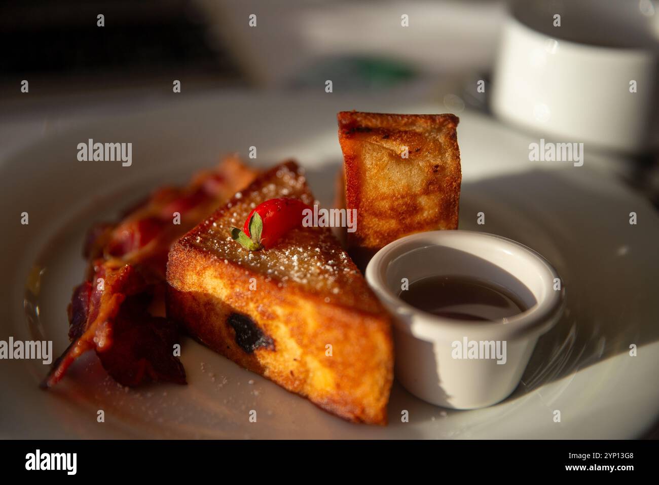 Cinnamon Raisin French Toast with maple syrup Stock Photo - Alamy