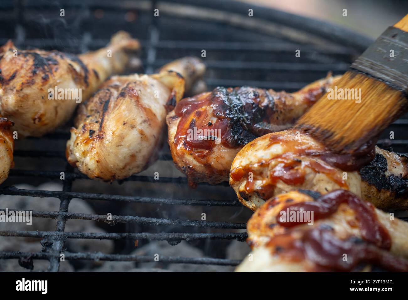 Cooking BBQ Chicken Legs on the grill Stock Photo - Alamy