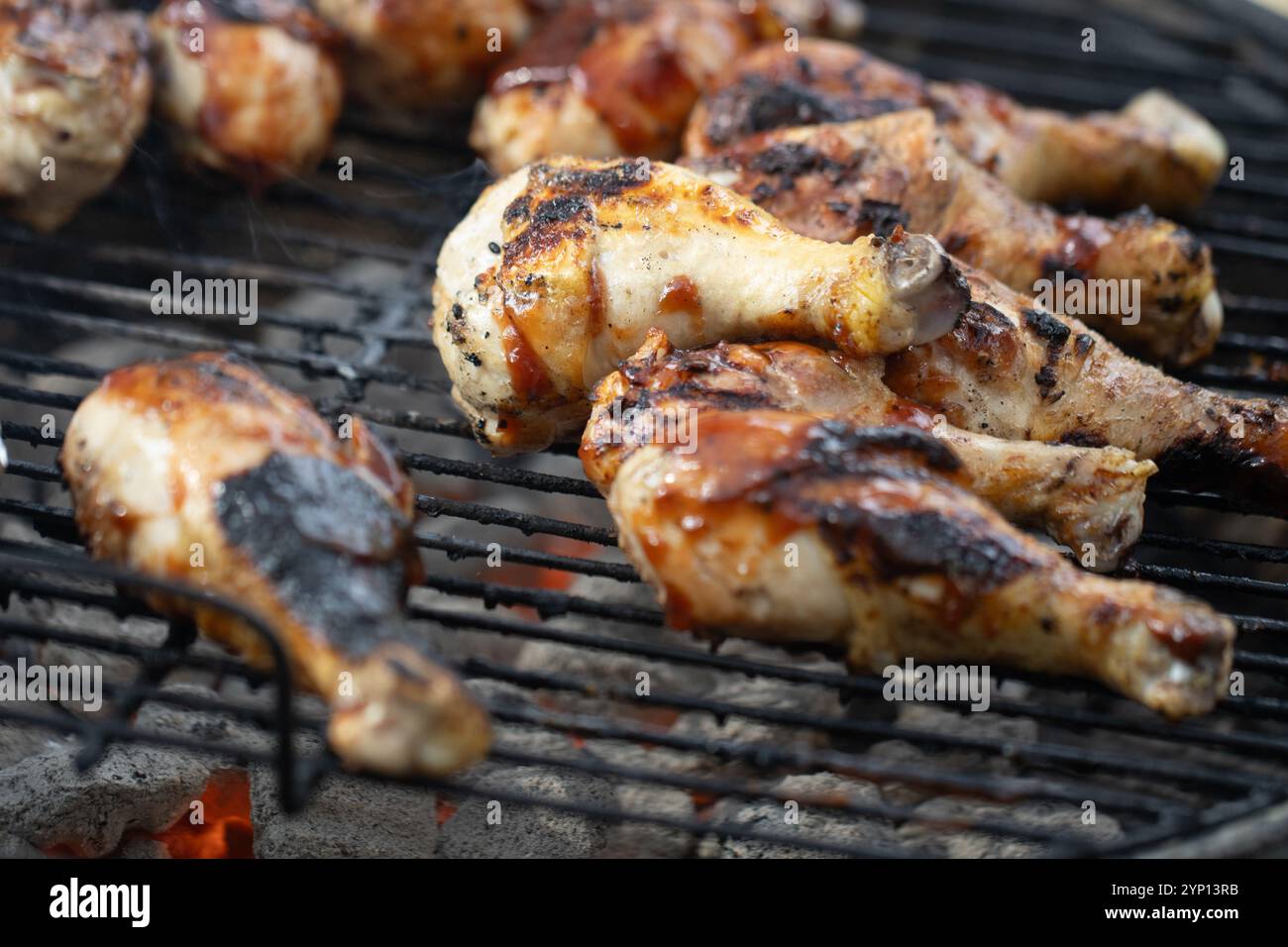 Cooking BBQ Chicken Legs on the grill Stock Photo - Alamy