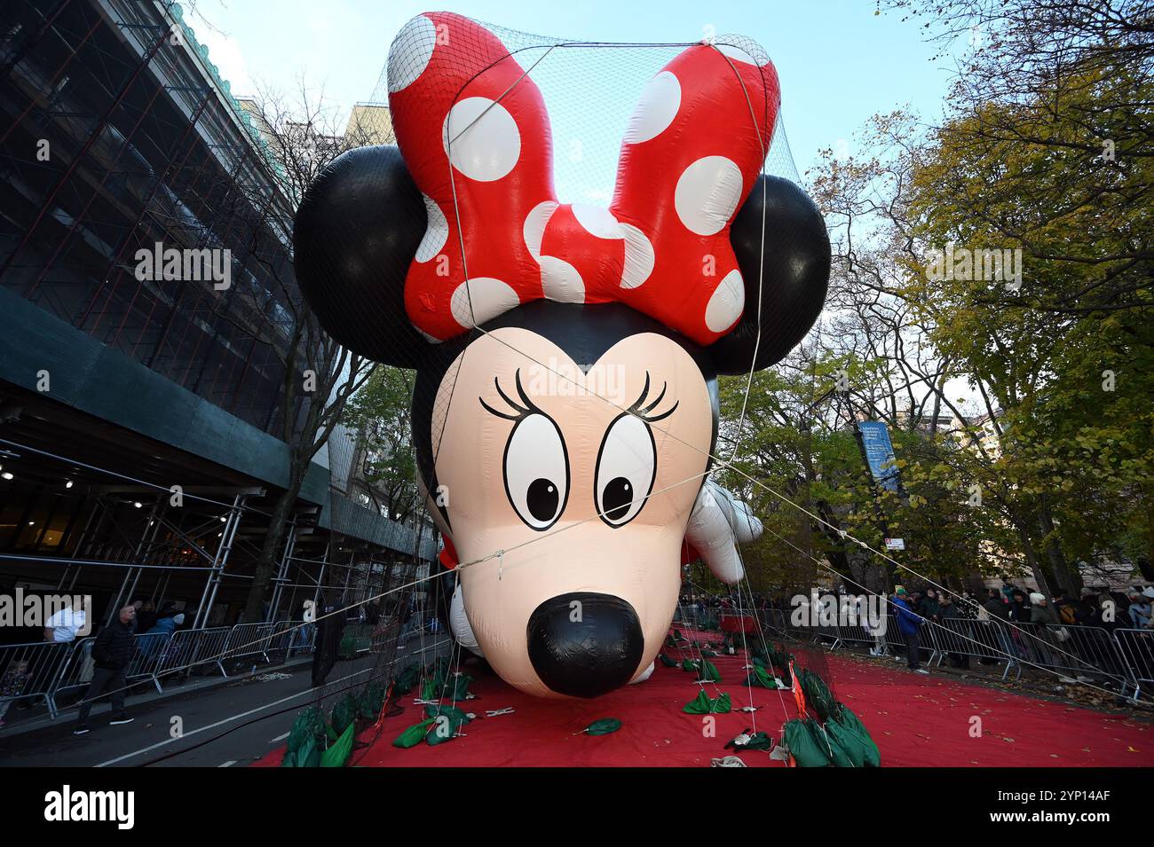 The Minnie Mouse balloon is held under a net during the annual balloon ...