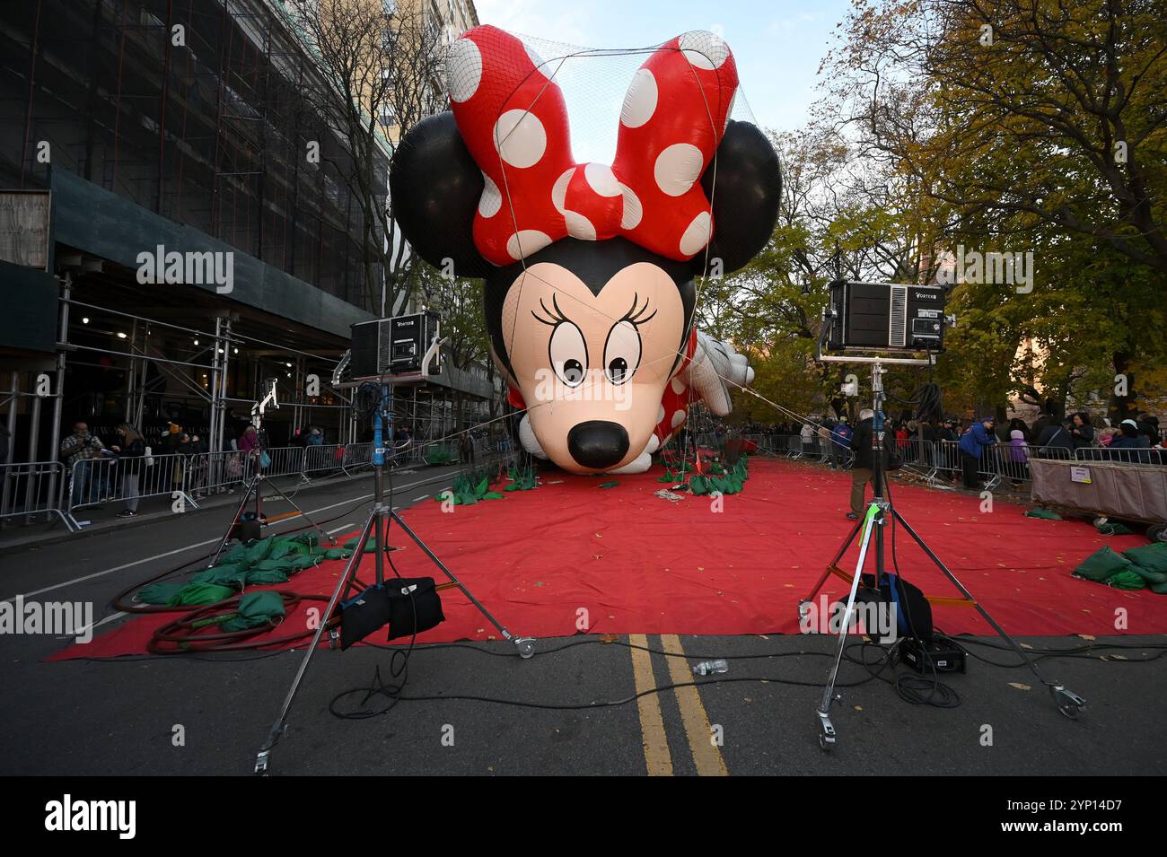 The Minnie Mouse balloon is held under a net during the annual balloon ...