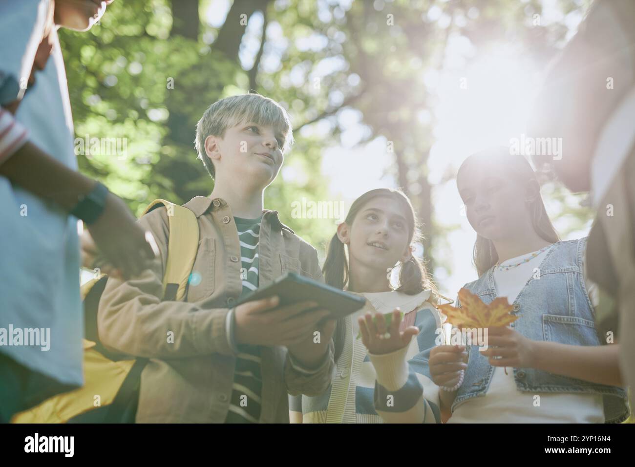 Teenagers Talking To Teacher During Outdoor Lesson Stock Photo - Alamy