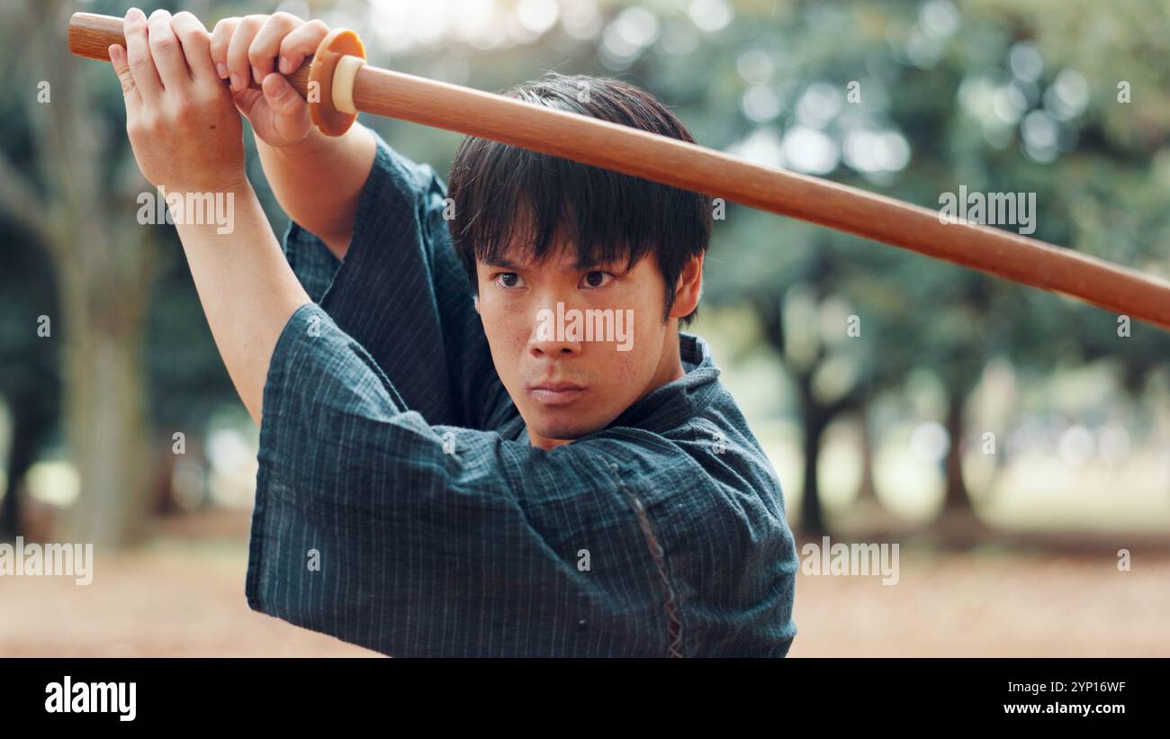 Wooden sword, Japanese man and outdoor for martial arts in training ...