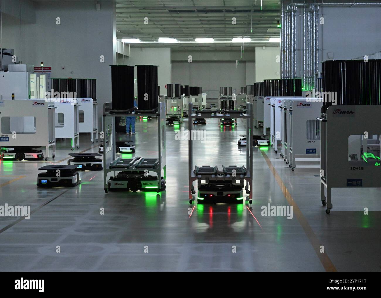 Mobile robots known as AGVs (Automated Guided Vehicle) work at a ...