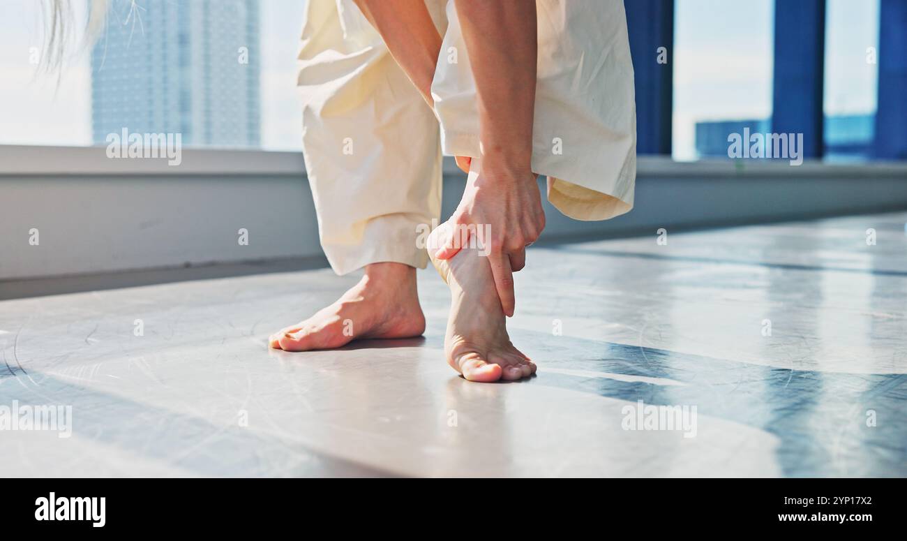 Injury, legs and dancer in studio, hurt and fracture on ankle, joint ...