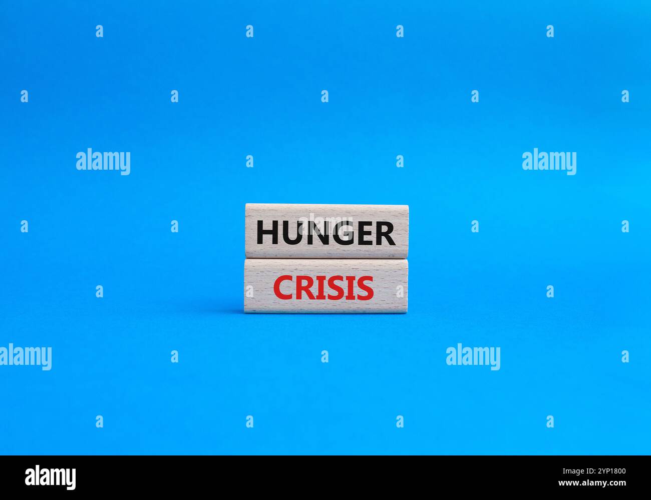 Hunger Crisis symbol. Wooden blocks with words Hunger Crisis. Beautiful ...