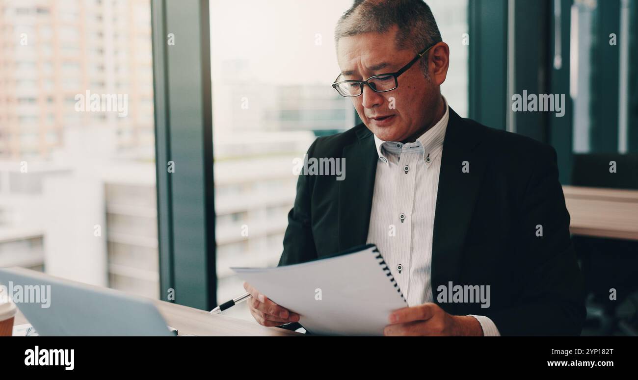 Office, Japanese businessman and serious with document for bookkeeping ...