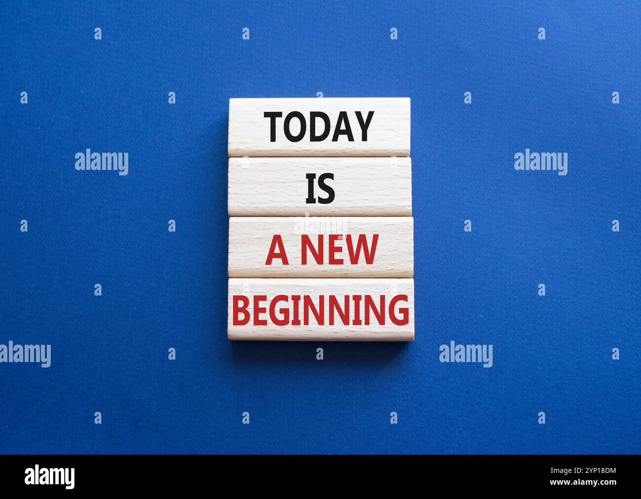 Today is a new beginning symbol. Wooden blocks with words Today is a ...