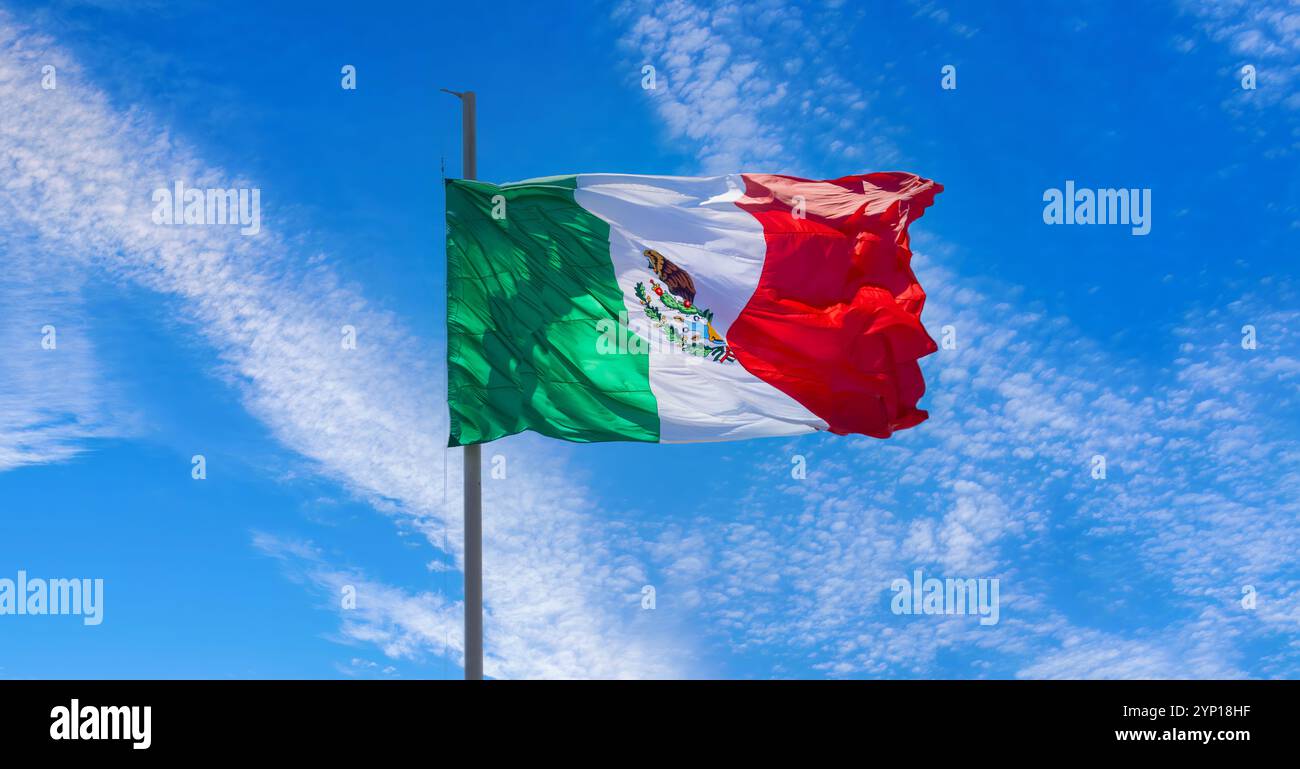 Los Cabos, Mexico, Mexican tricolor national striped flag proudly ...