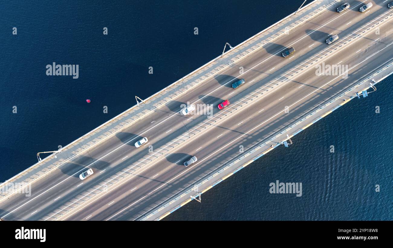 Aerial top view of bridge road automobile traffic of many cars from ...