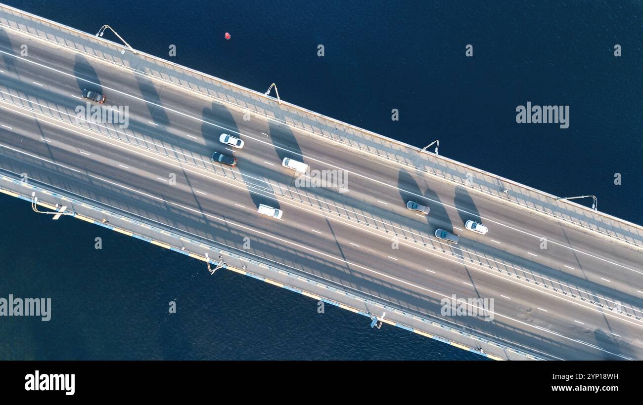 Aerial top view of bridge road automobile traffic of many cars from ...