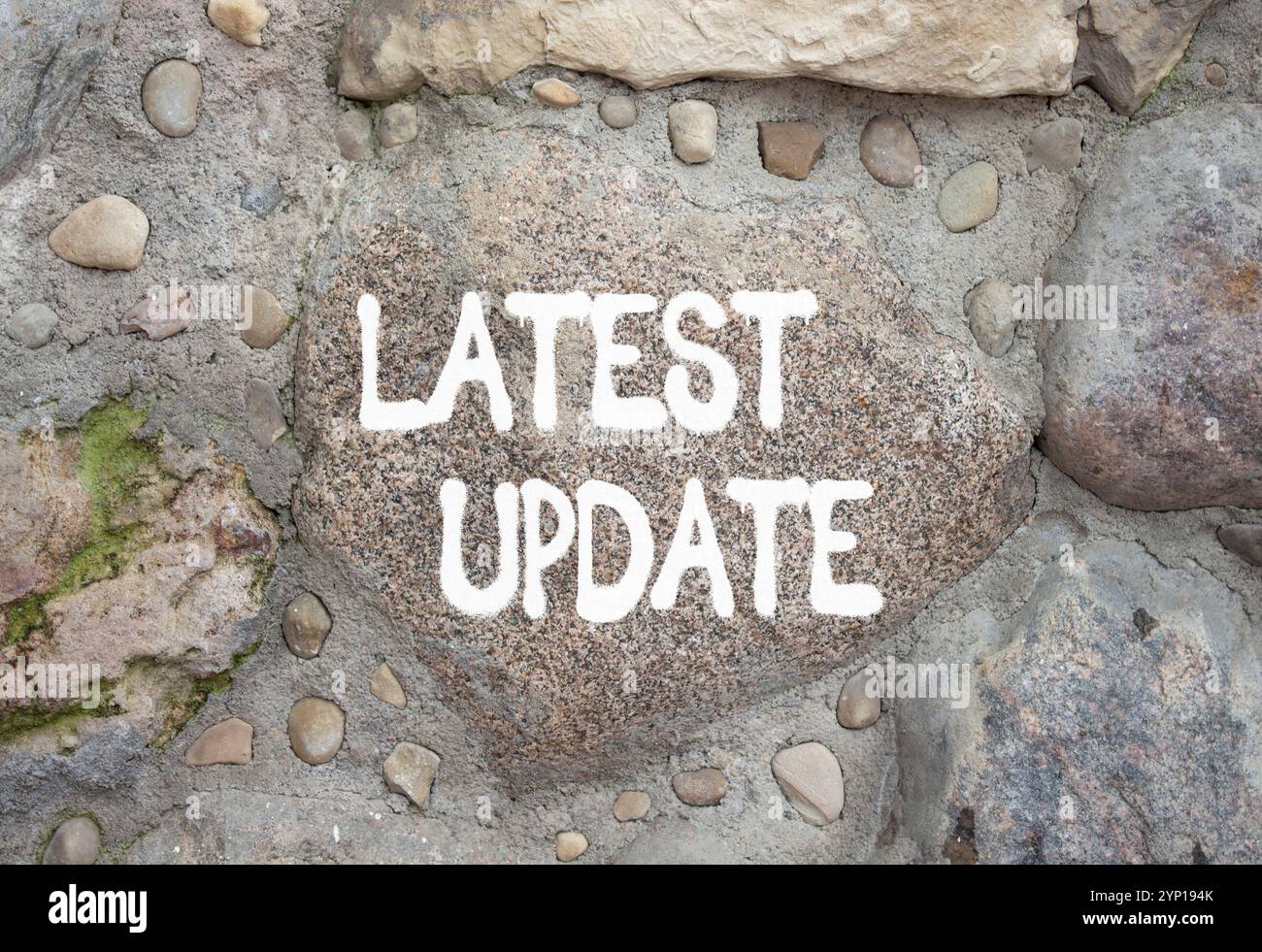 Latest update symbol. Stone wall with words Latest update. Beautiful ...