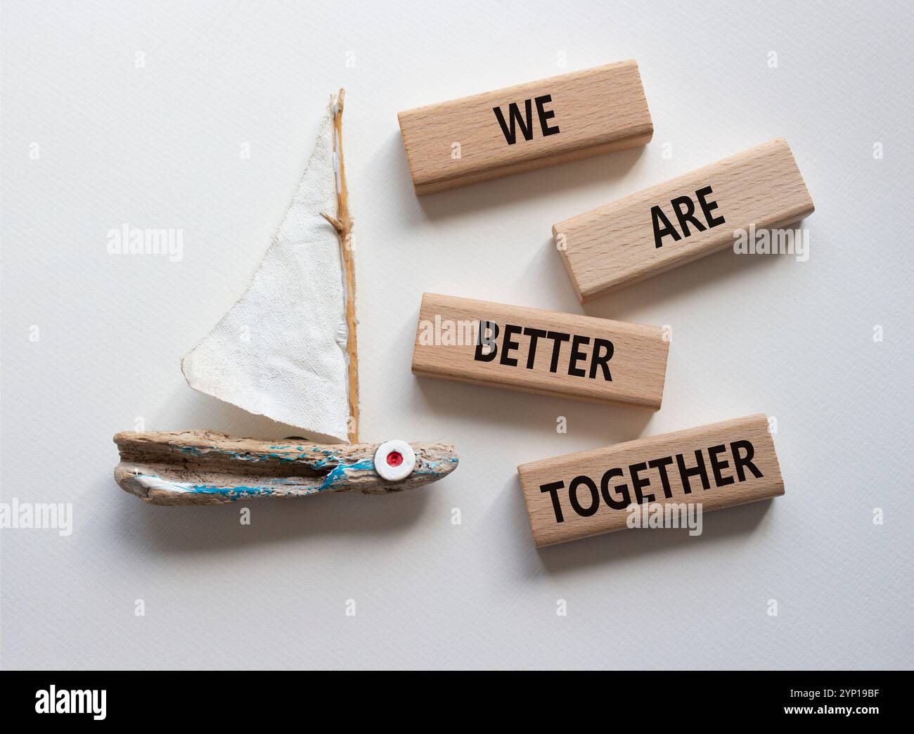 We are better together symbol. Wooden blocks with words We are better together. Beautiful white ...