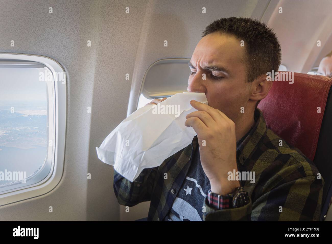 Man vomiting in the aeroplane hi-res stock photography and images - Alamy