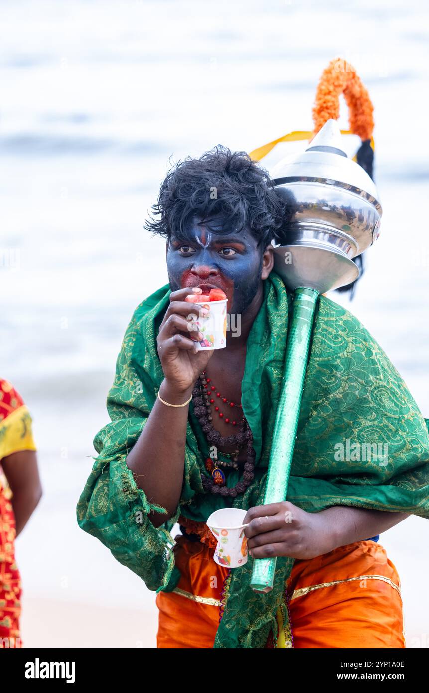 Kulasai, Portrait of indian hindu devotee with painted face and dressed ...