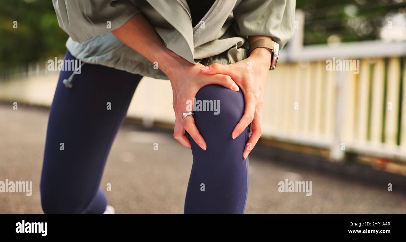 Outdoor, person and fitness with hands on knee pain from running with ...