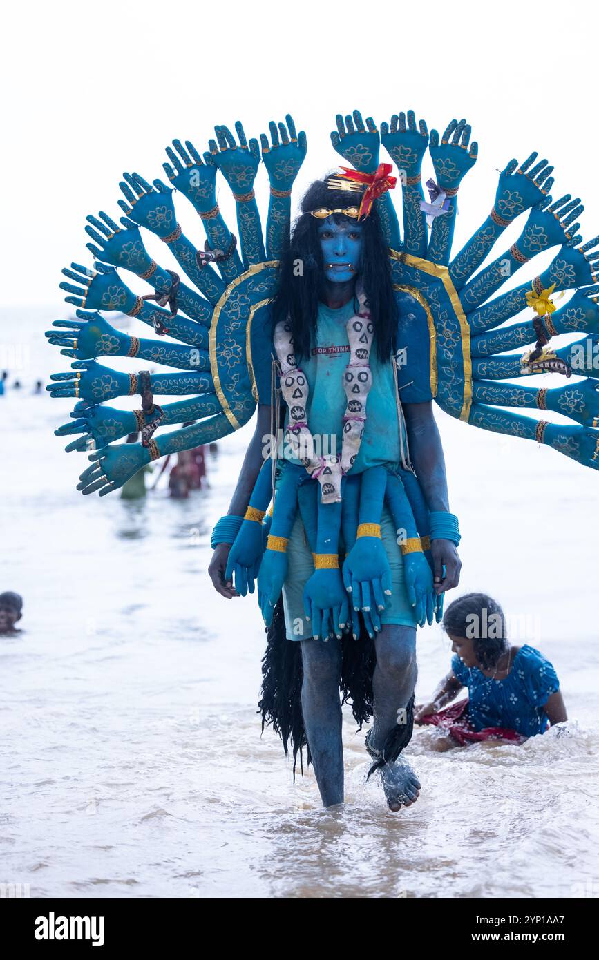 Kulasai, Portrait of indian hindu devotee with painted face and dressed ...