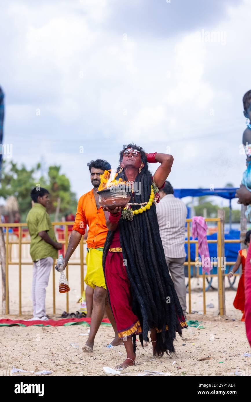 Kulasai, Portrait of indian hindu devotee with painted face and dressed ...