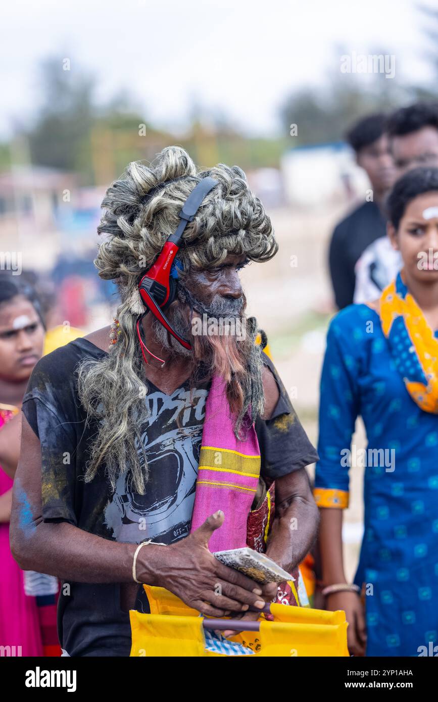 Kulasai, Portrait of indian hindu devotee with painted face and dressed ...