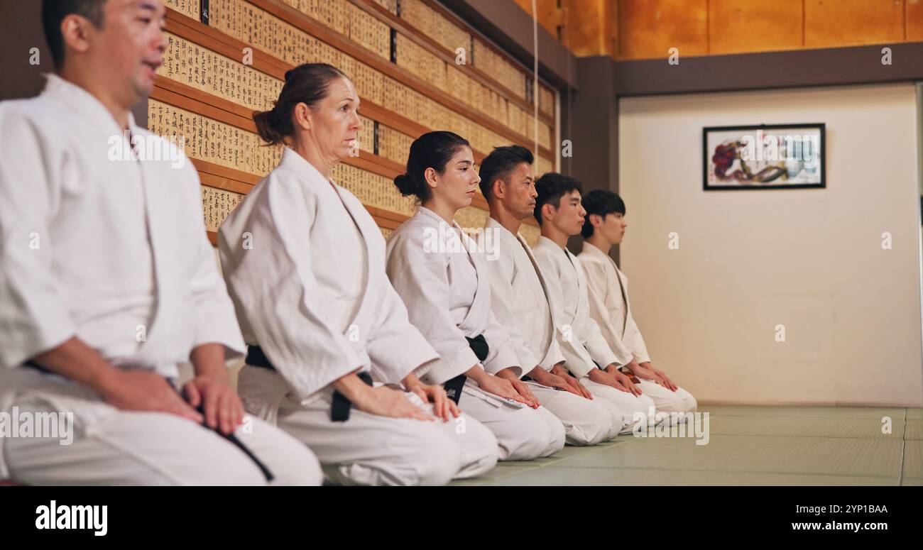 Discipline, kneeling and people in martial arts studio for practice ...