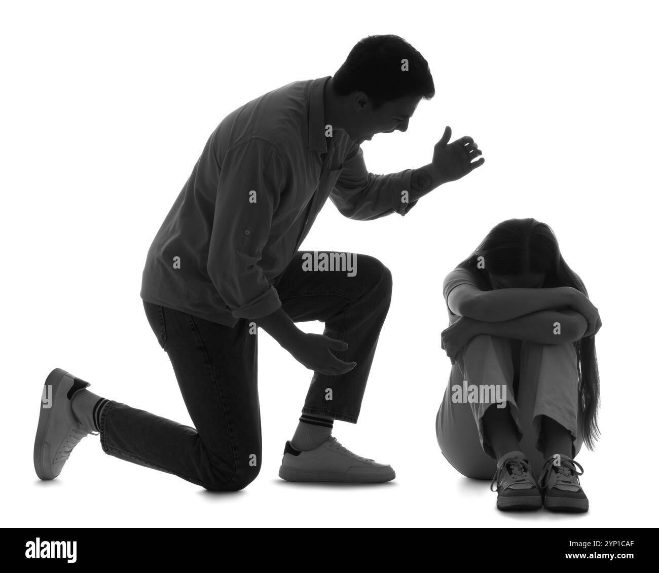 Silhouette of angry man shouting at woman on white background. Domestic ...